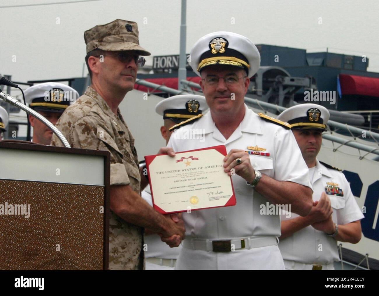US Navy Chief of Naval Personnel, Vice Adm. John C. Harvey Jr., right ...