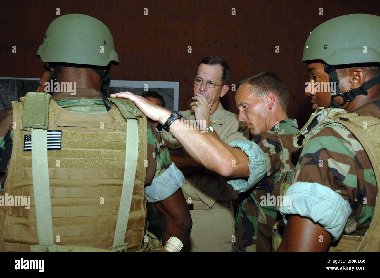 US Navy Chief of Naval Operations (CNO) Adm. Mike Mullen listens to ...