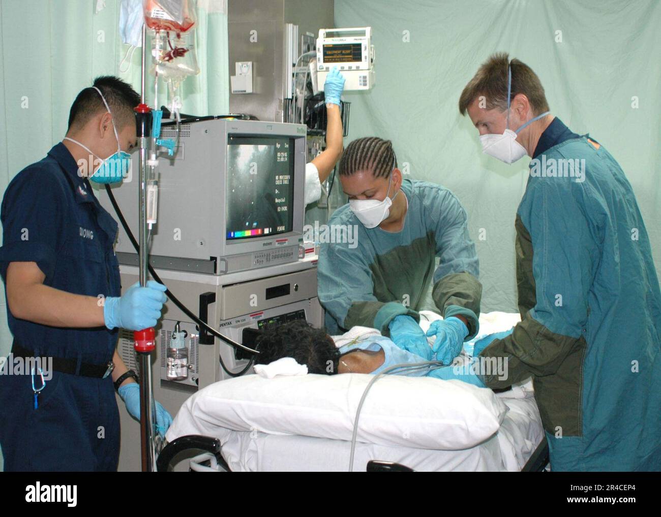 US Navy Lt. Cmdr. right, Hospital Corpsman 3rd Class left) and ...