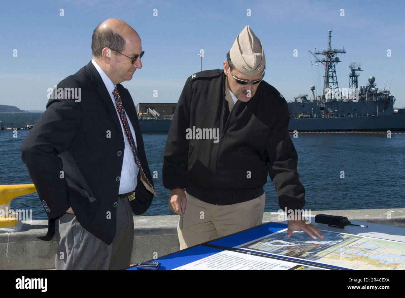 US Navy Commanding Officer Naval Station Everett, Capt. presents a ...