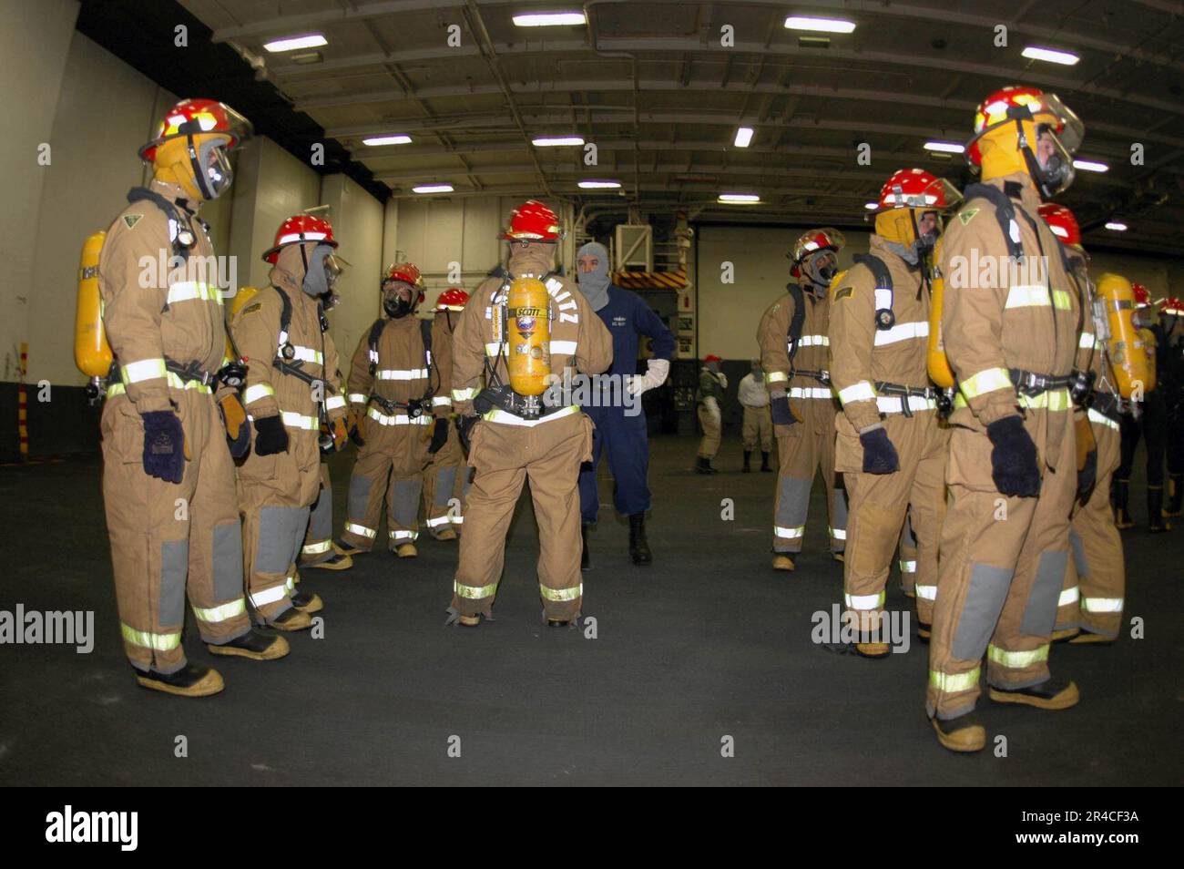 US Navy Crew members stand by during a general quarters (GQ) drill in ...