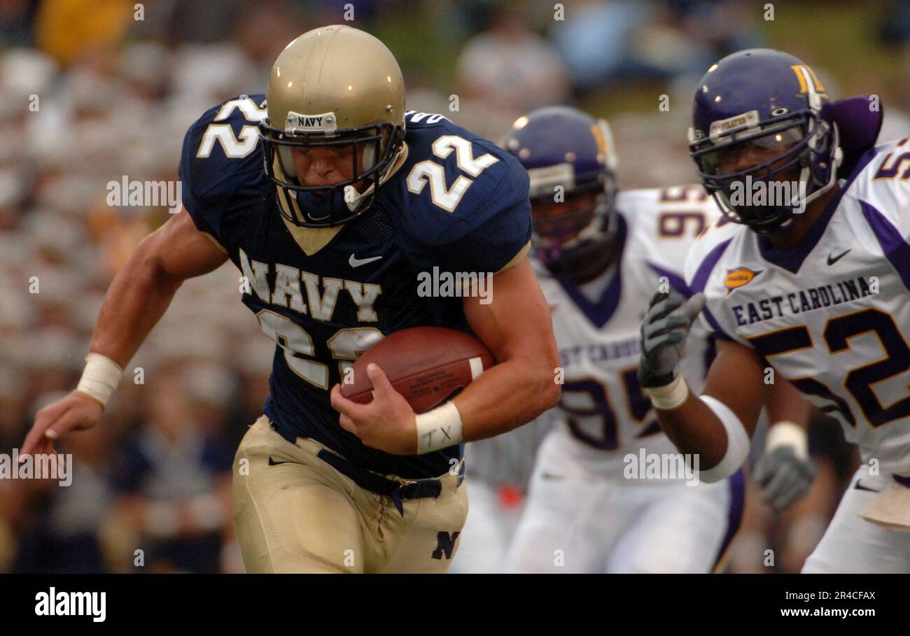US Navy U.S. Naval Academy Midshipman fullback is chased by East ...