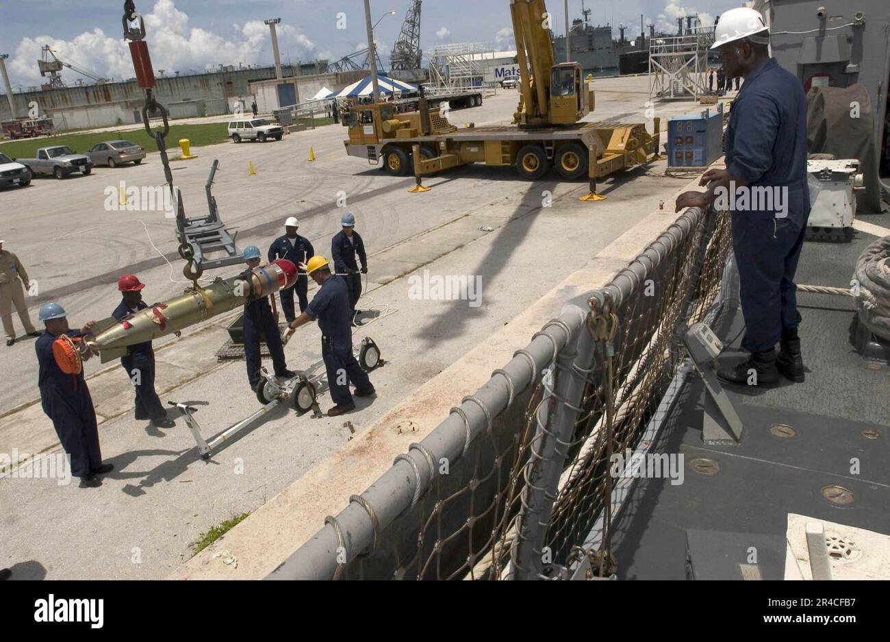 US Navy Sailors assigned to the Arleigh Burke-class guided missile ...
