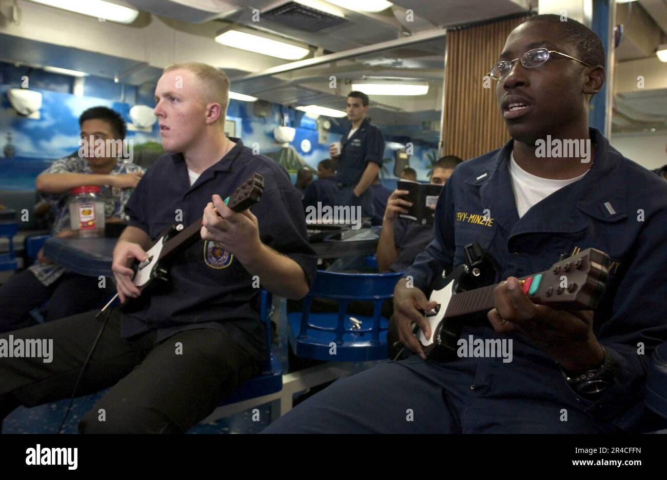 US Navy Culinary Specialist Seaman left and Lt J.G. play an electric ...