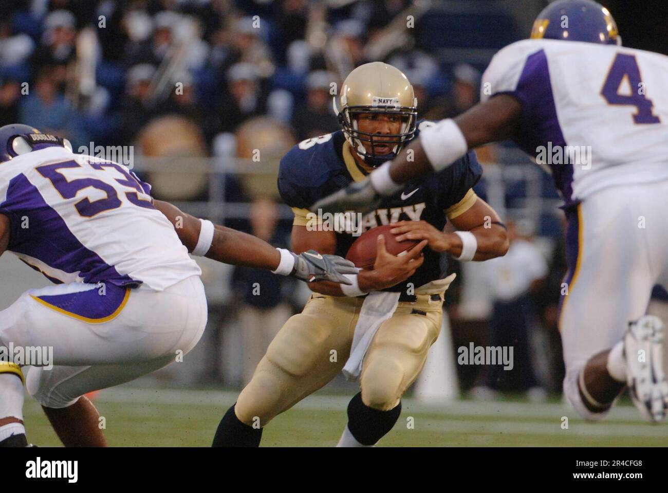 US Navy U.S. Naval Academy Quarterback rushes for yardage and tries to ...