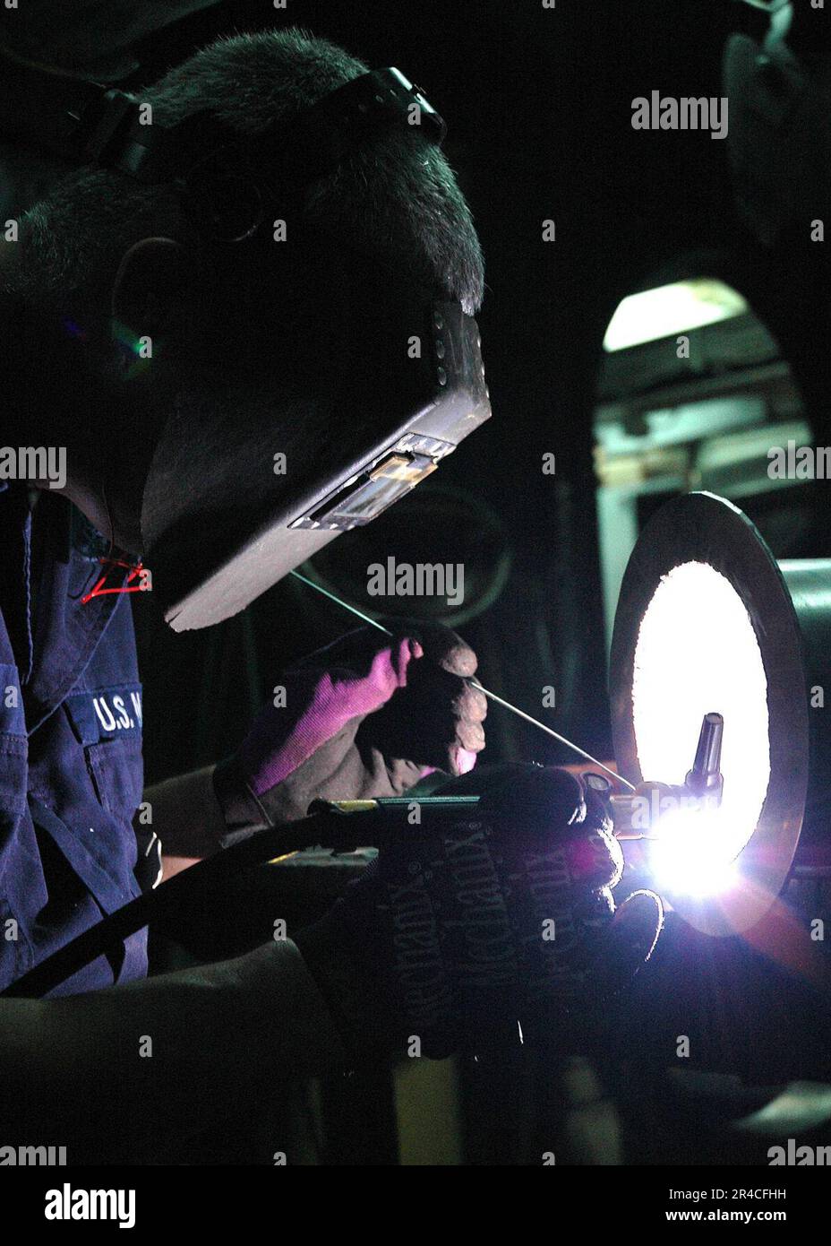 US Navy Hull Technician 1st Class uses a Gas Tungsten Arc Welder to ...