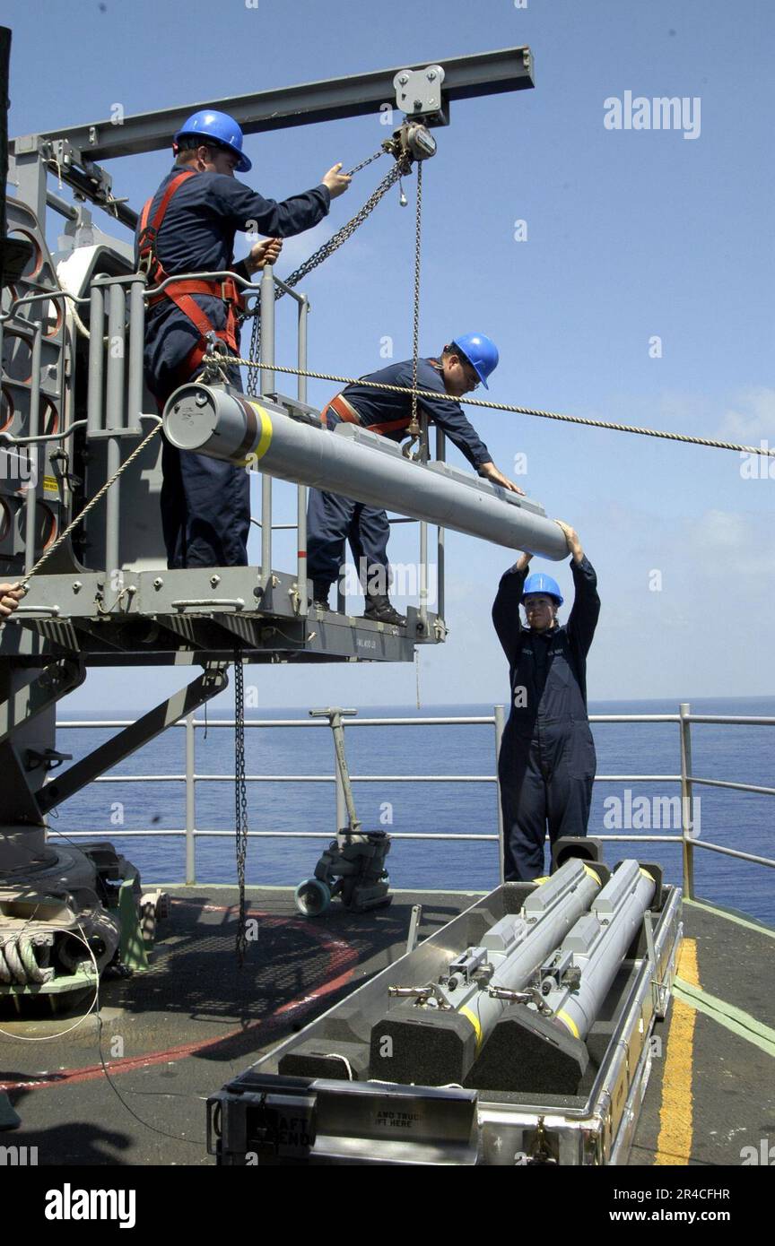 US Navy Crew members aboard the multi-purpose amphibious assault ship ...