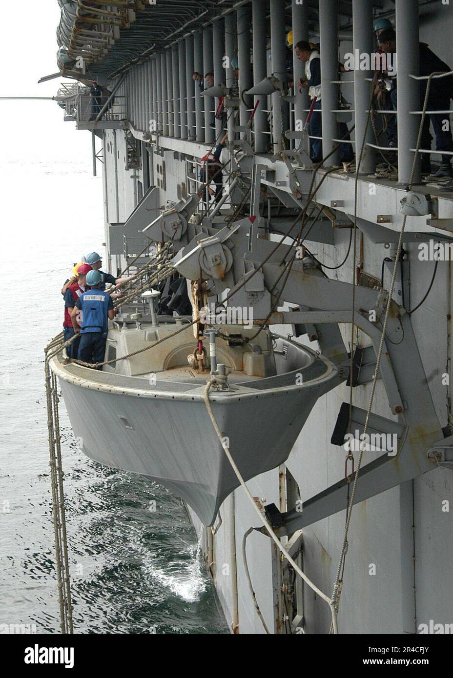 US Navy A Landing Craft Personnel Large (LCPL) is lowered over the side ...