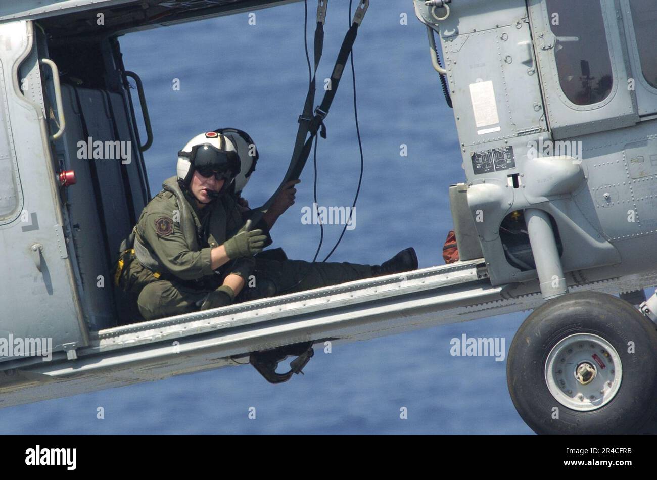 US Navy An MH-60S Air Crewman from Helicopter Sea Combat Support ...