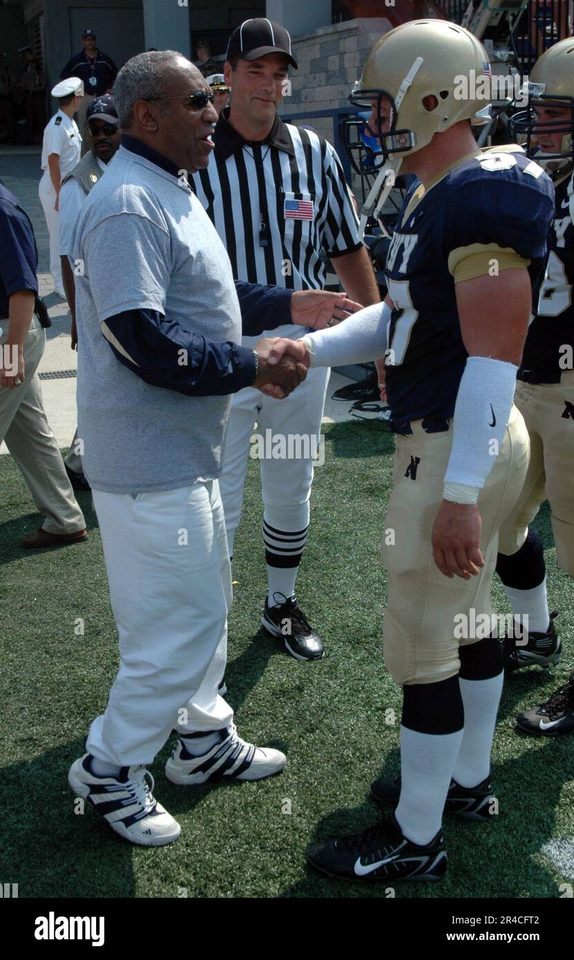US Navy Entertainer Bill Cosby shakes hands with Navy linebacker prior ...