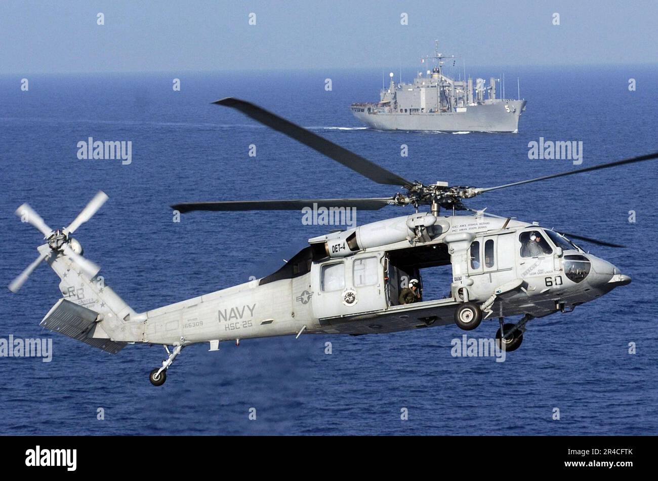 US Navy An MH-60S Seahawk assigned to Helicopter Sea Combat Support Squadron Two Five (HCS-25 ...