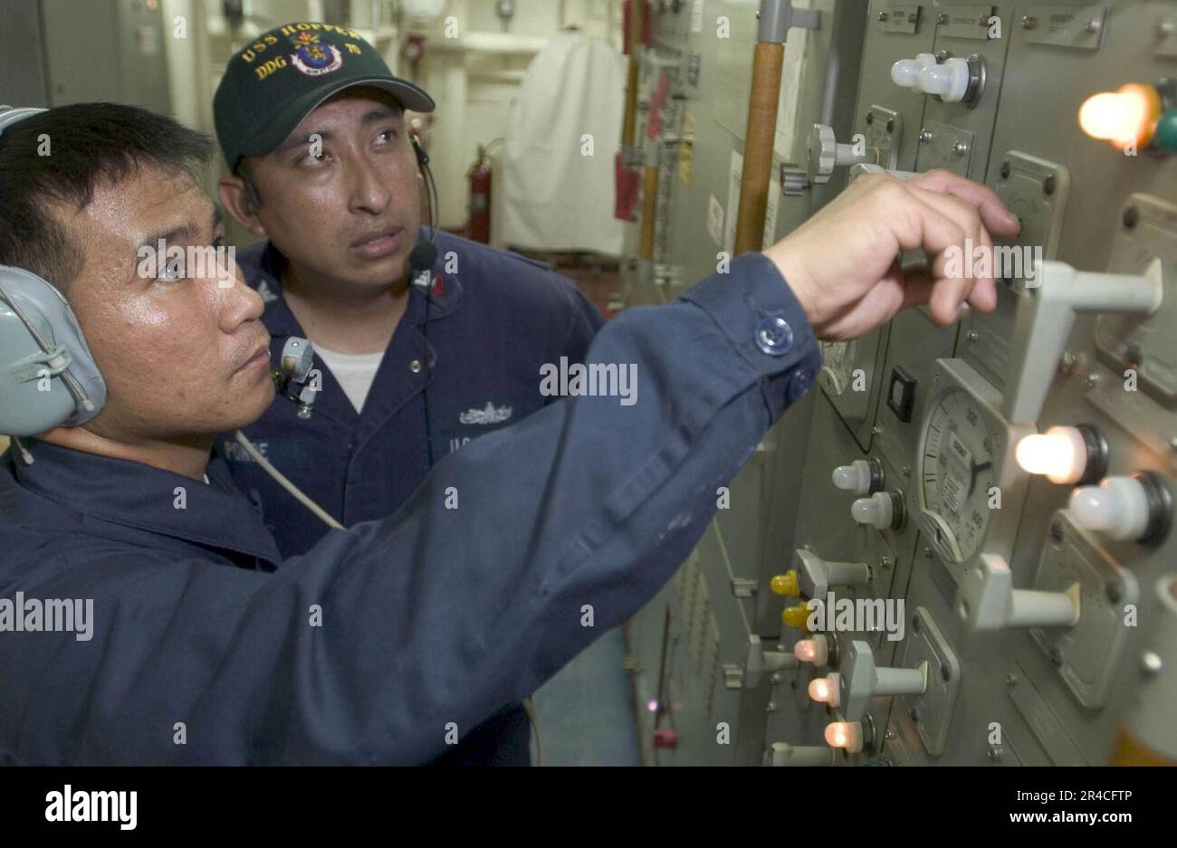 US Navy Electrician's Mate Fireman simulates the control of an ...