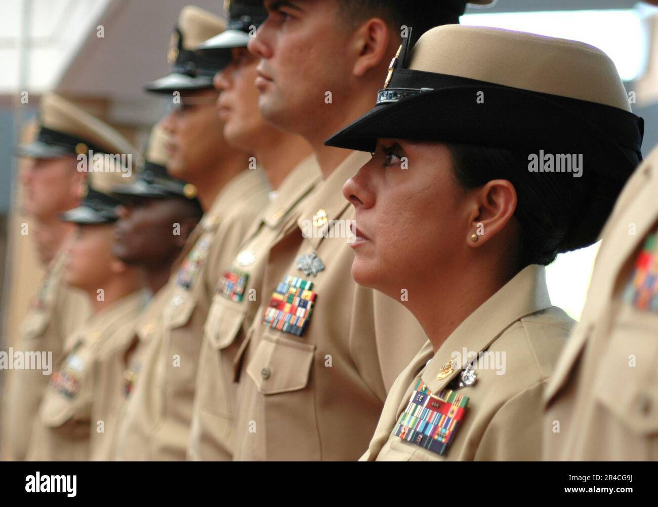 US Navy Chief Master-at-Arms, stands along side of her new fellow chief ...