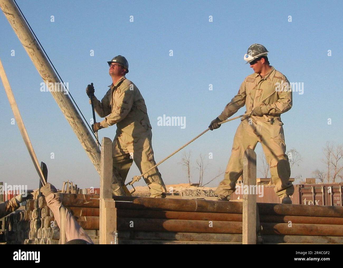 US Navy Equipment Operator 1st Class, (left) and Construction ...