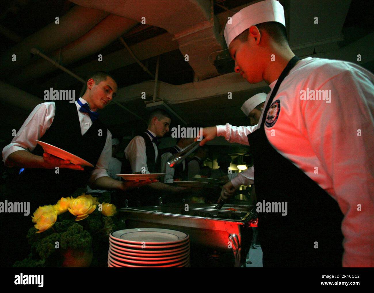 US Navy U.S. Navy Culinary Specialist 2nd Class right, serves steak ...