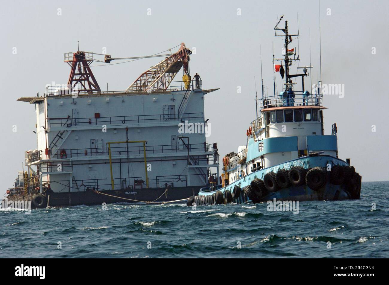 US Navy The chartered barge Ocean 6 being towed by tug boat Dona II in ...