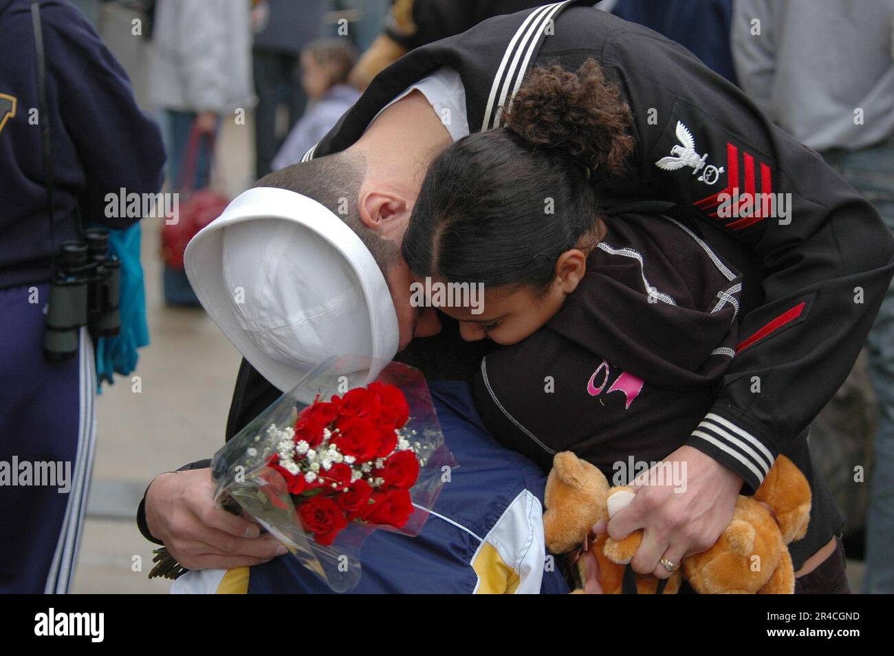 US Navy Operations Specialist 1st Class hugs his children for the first ...