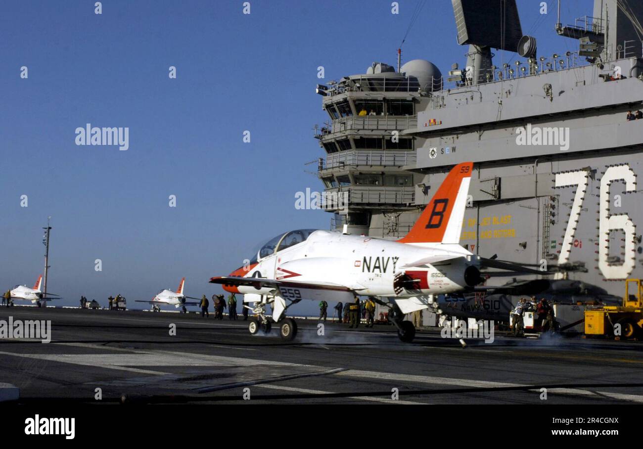 US Navy Lt. j.g. pilots a T-45 Goshawk training aircraft as it makes an ...