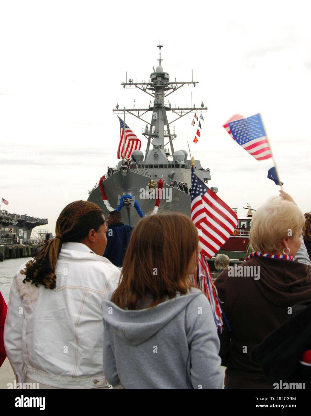 US Navy Family members wait anxiously for their loved ones to return ...
