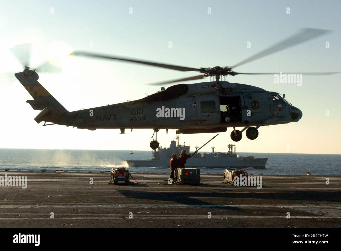 US Navy Sailors assigned to the weapons department clear the landing ...
