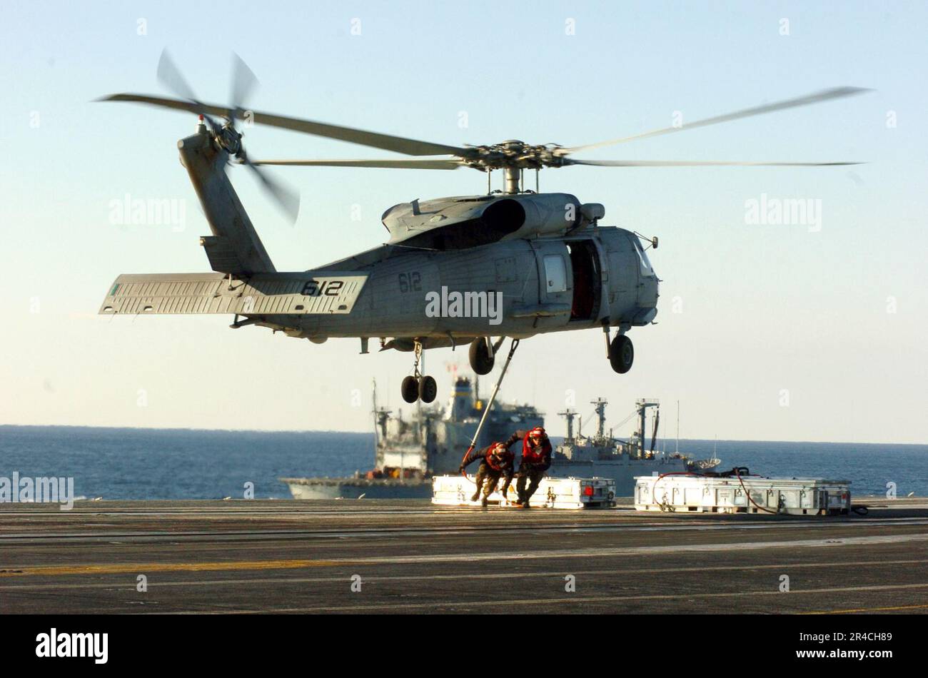 US Navy Sailors assigned to the weapons department aboard USS Theodore ...