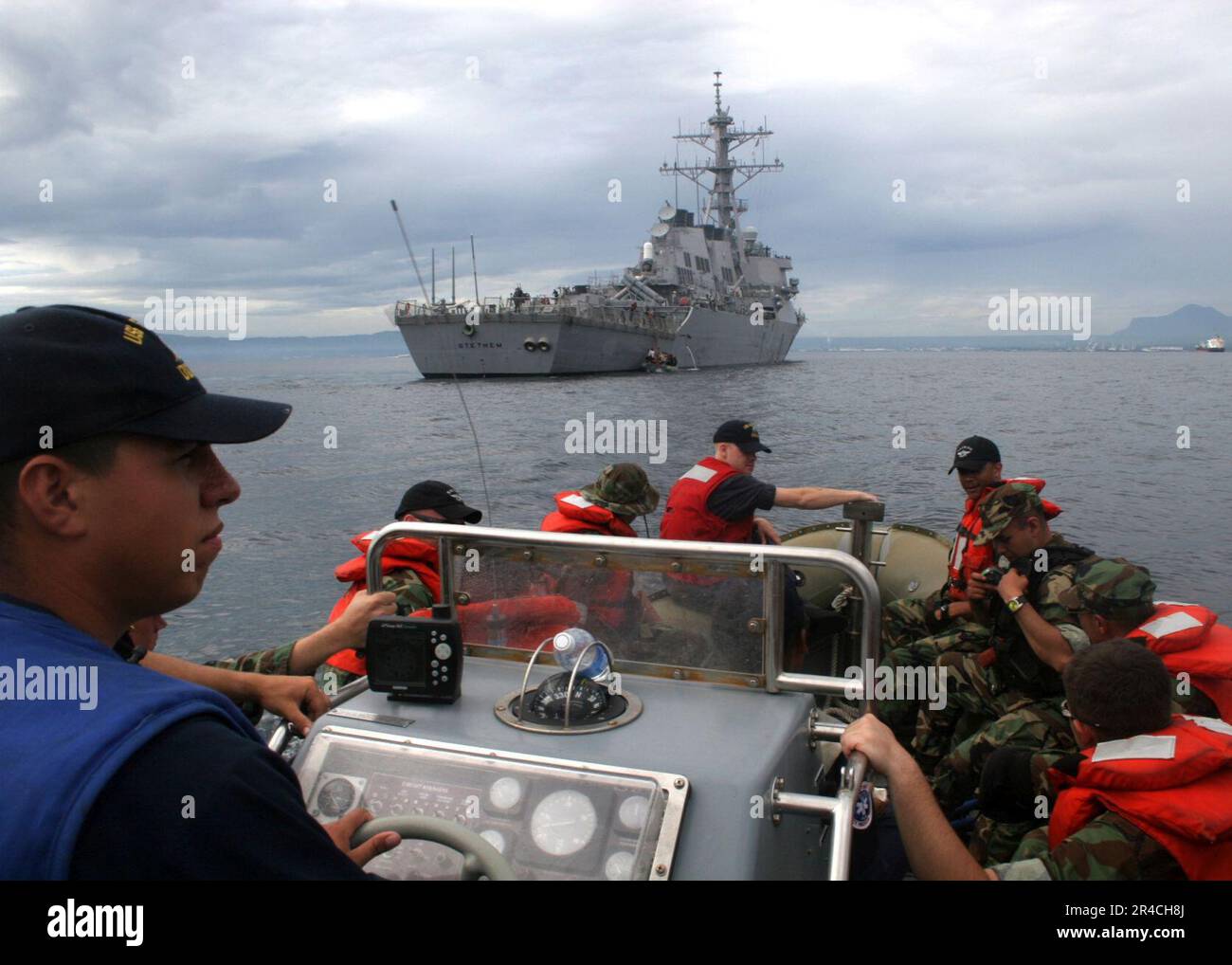 US Navy Boatswain's Mate 3rd Class performs duties as Coxwain (under ...