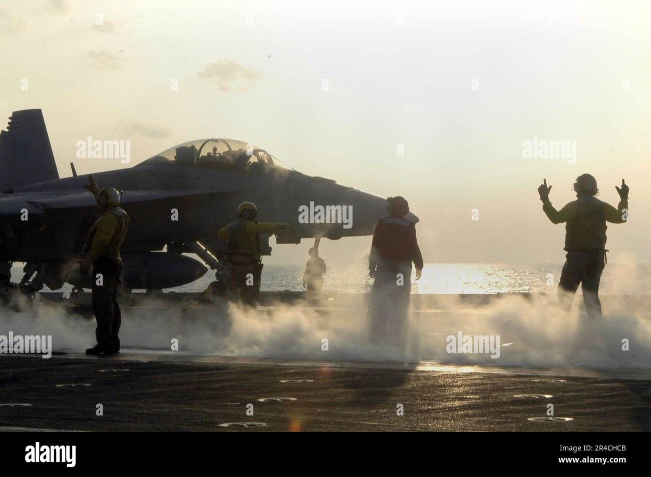US Navy Aircraft directors signal an F-A-18F Super Hornet assigned to ...