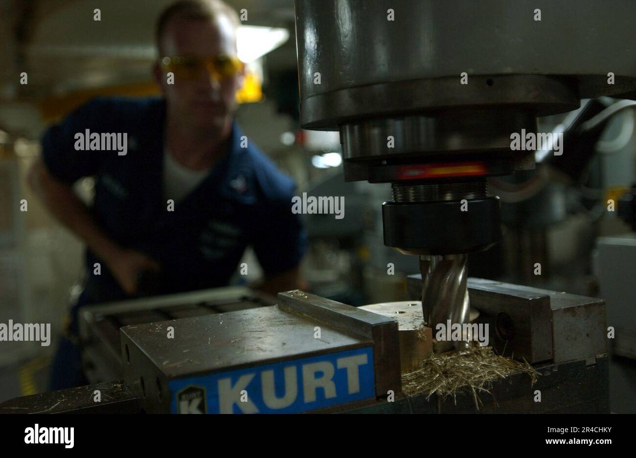 US Navy Machinery Repairman 3rd Class manufactures a clasp on a ...