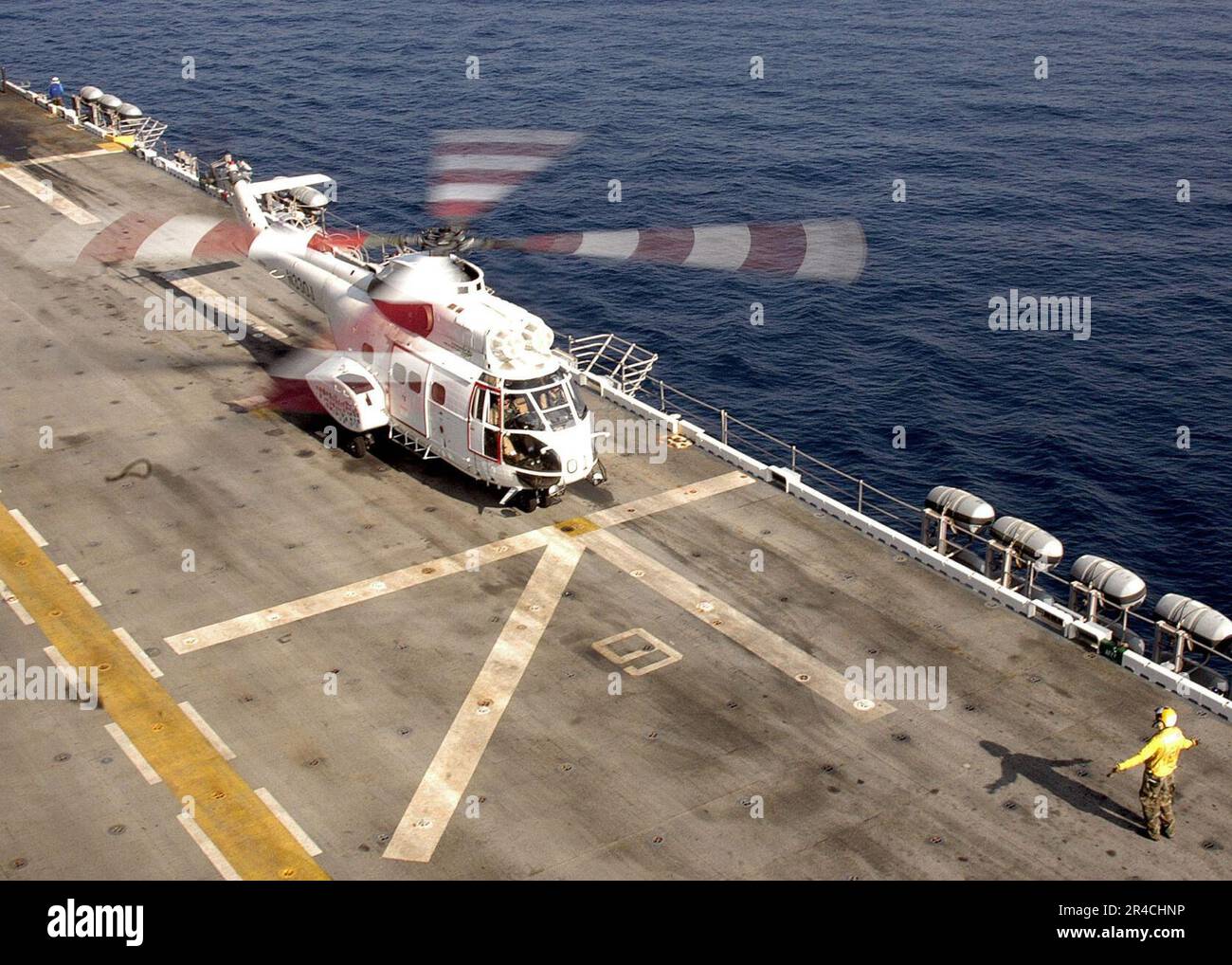 US Navy A SA-330 Puma helicopter is directed to lift off the flight ...