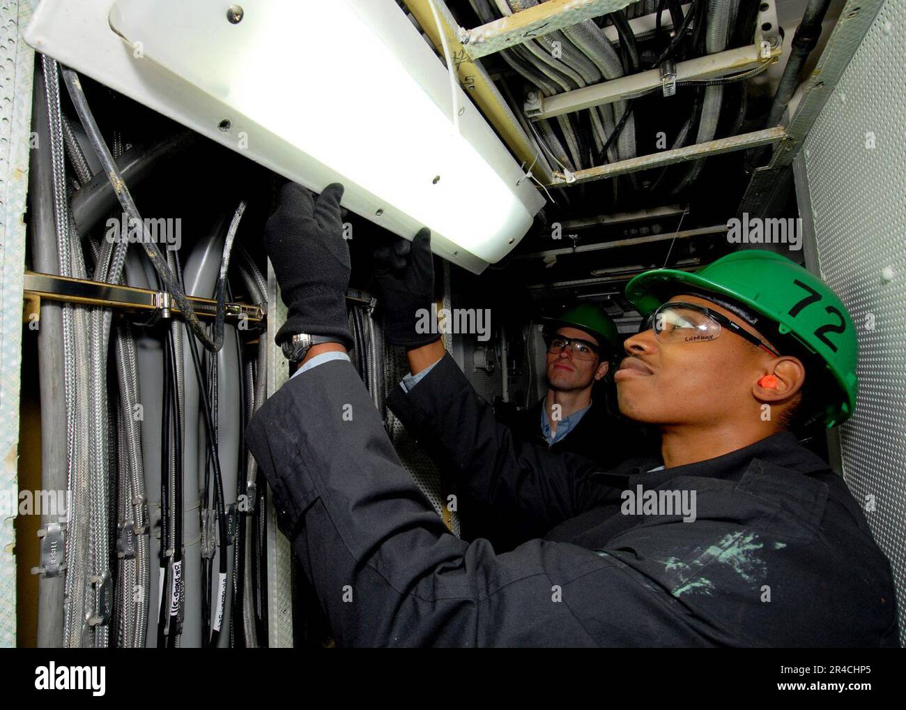 US Navy Aviation Ordnanceman 3rd Class and Fire Controlman 3rd Class of ...