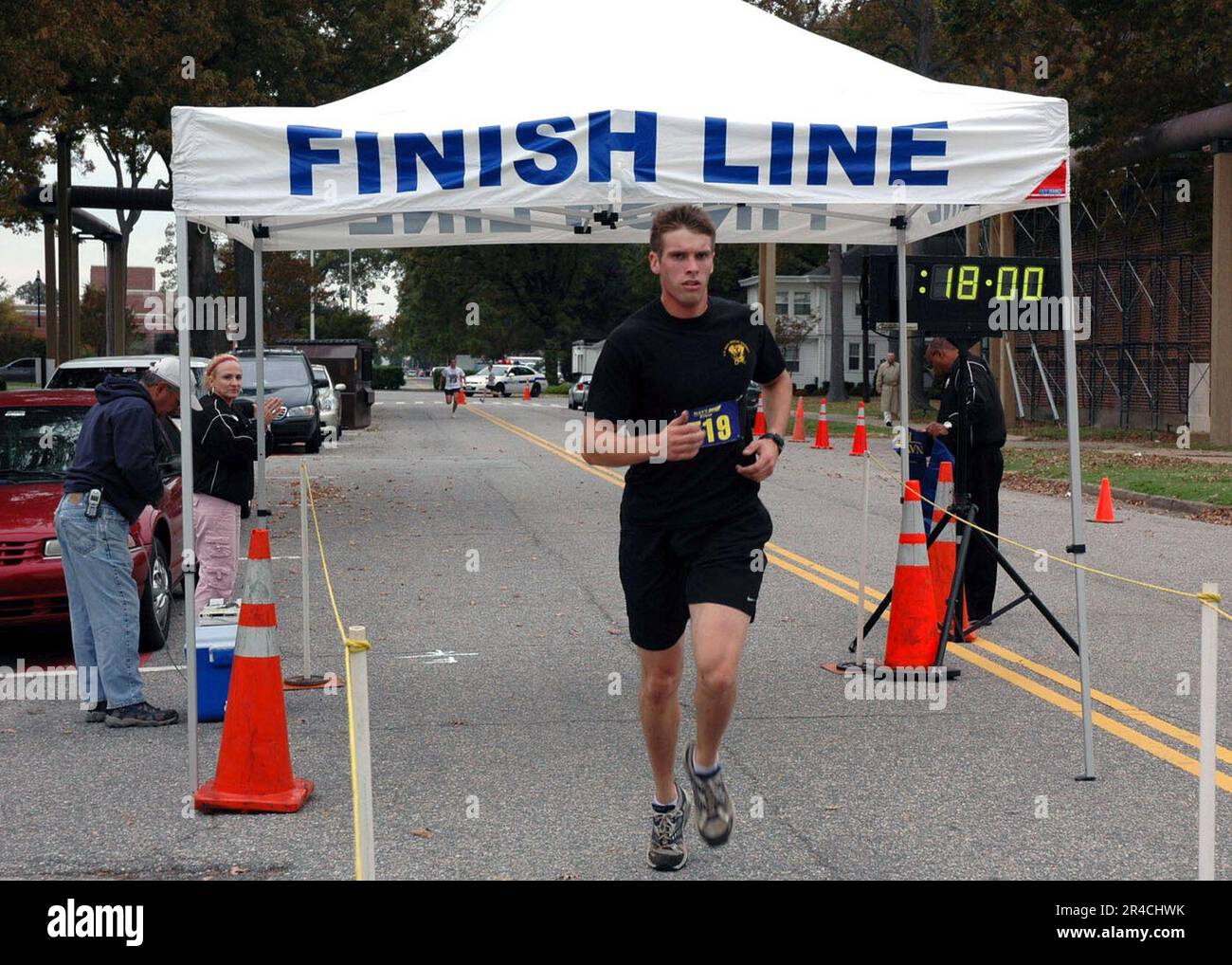 US Navy Mass Communication Specialist 3rd Class crosses the finish line ...