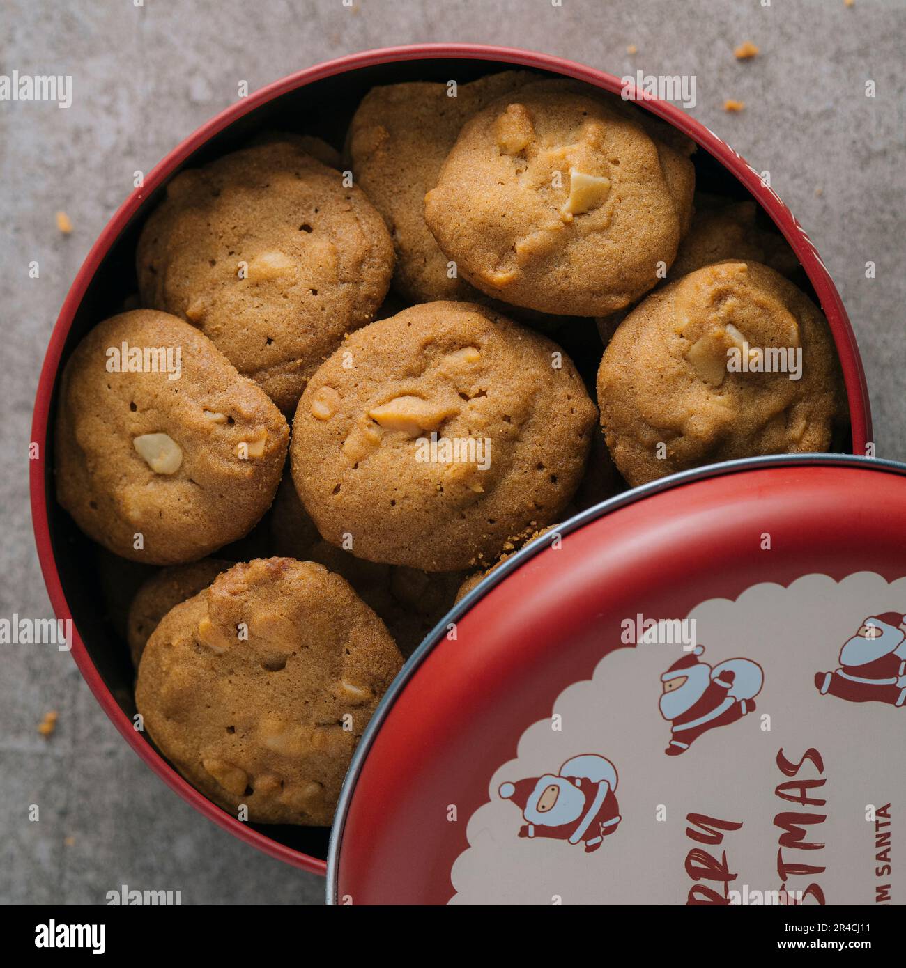 Cookies laid out in a Christmas tin shot from the top Stock Photo - Alamy