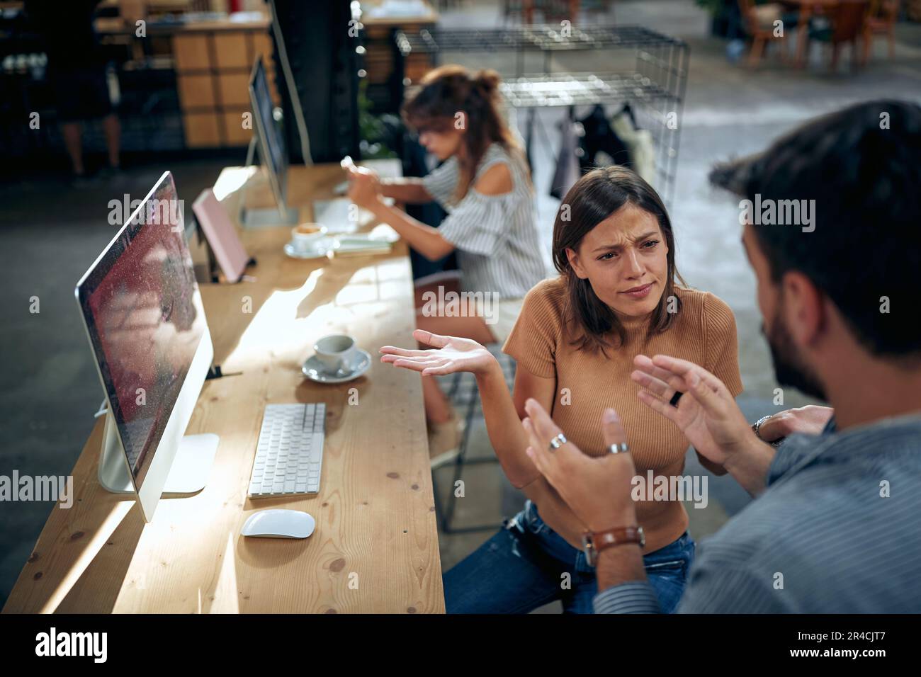 Employees sitting in creative moden office, manager talking with female ...