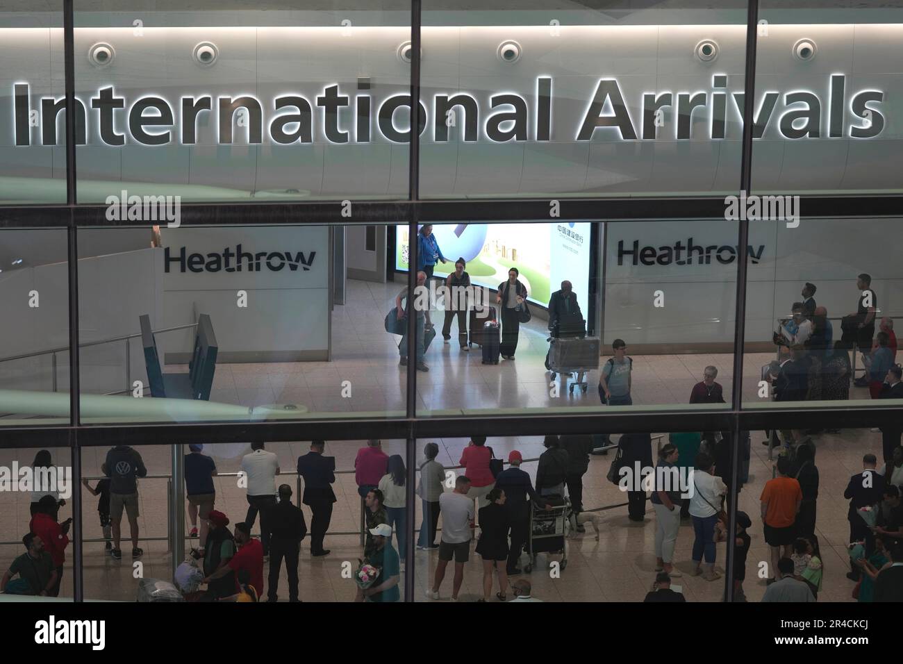 Passengers arrive at the Heathrow Airport, in London Saturday, May 27 ...