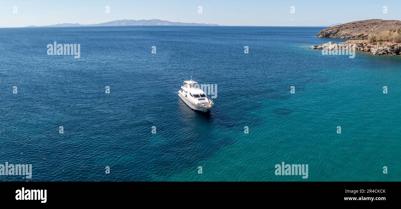 Greece summer destination Cyclades island. Moored luxury yacht in calm ...