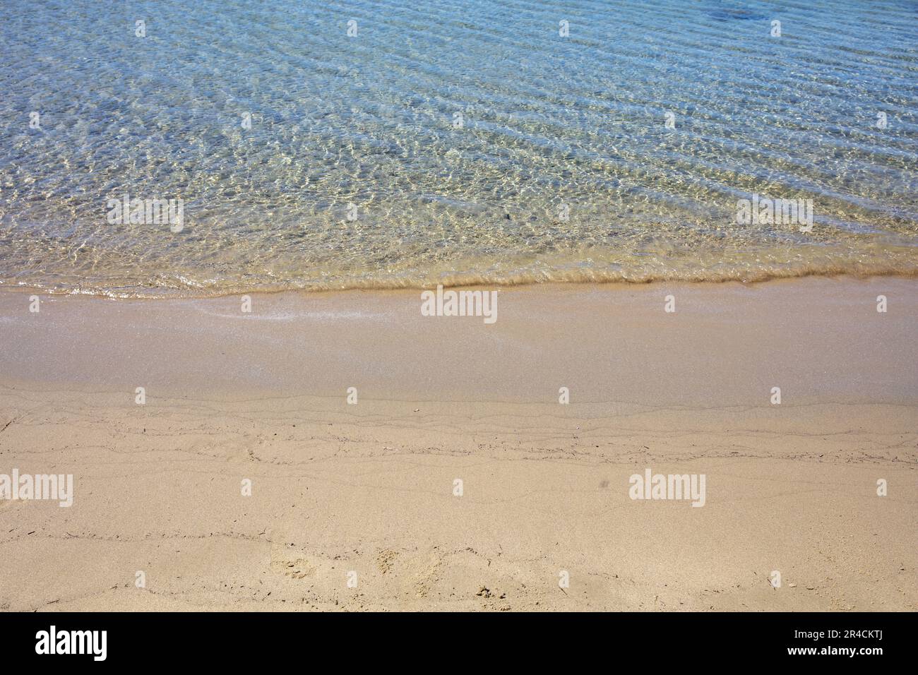Sandy empty beach, ocean transparent rippled Aegean sea water touch wet ...
