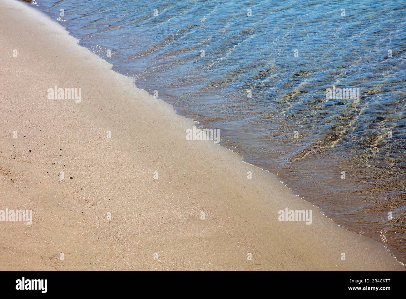 Sandy empty beach, ocean transparent rippled Aegean sea water touch wet ...