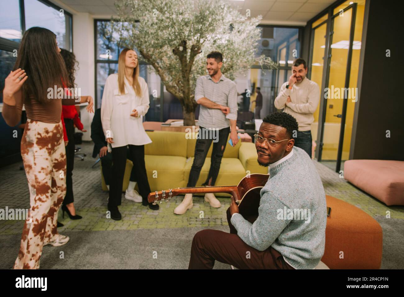 People play music on their speaker and dancing before their black male ...