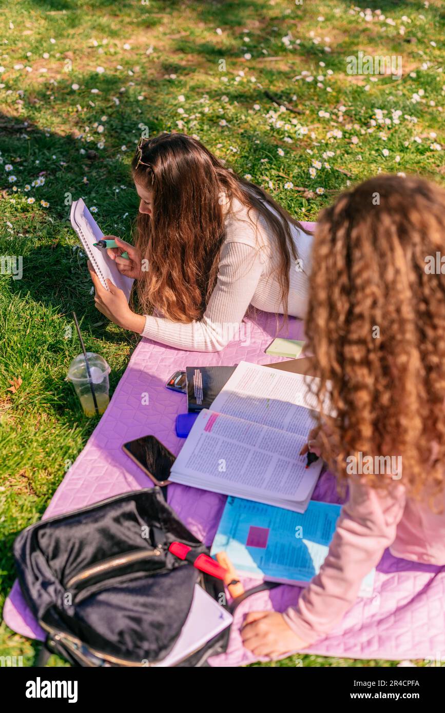 Girl underlining important parts before exam Stock Photo - Alamy
