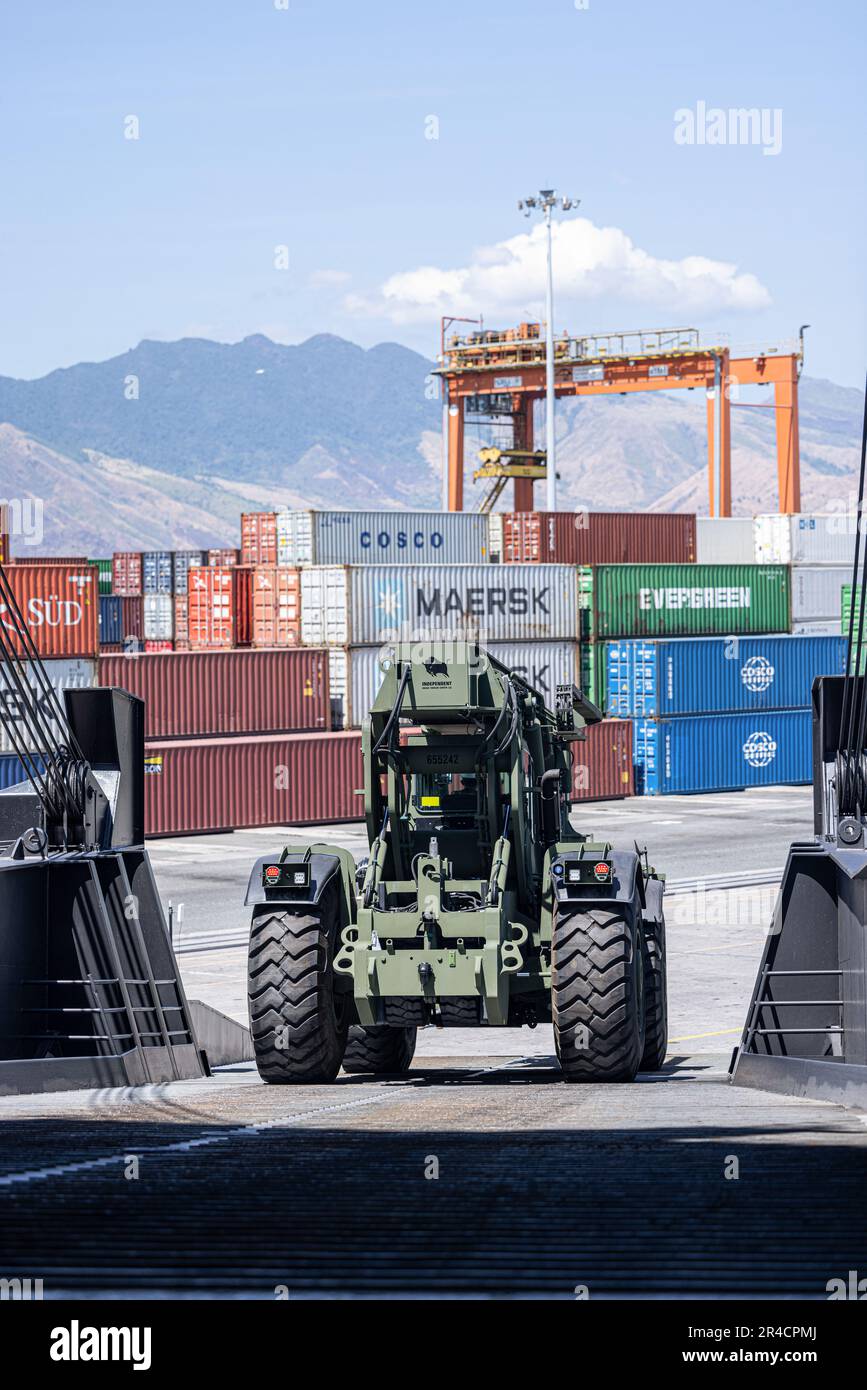 A U.S. Marine Corps Rough Terrain Cargo Handler is offloaded from U.S ...