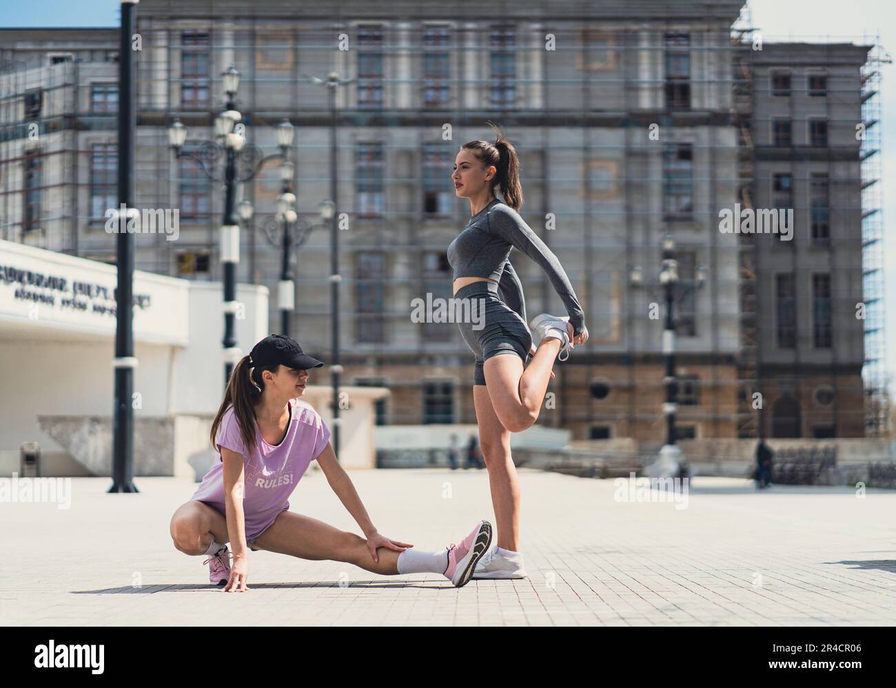 Sportsgirls stretching legs hi-res stock photography and images - Alamy