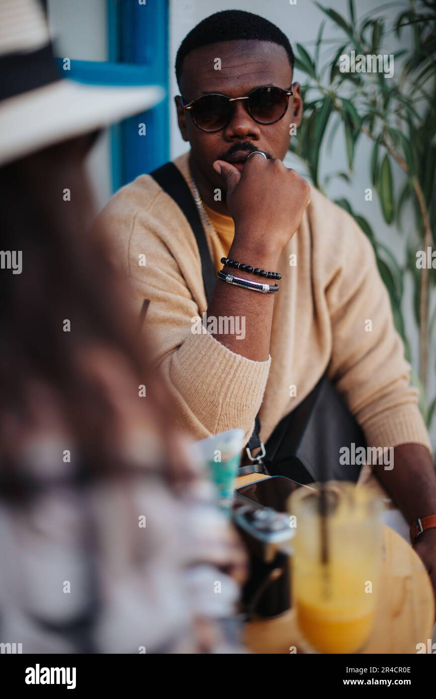 Tourist thinking while sitting at the cafe with his girlfriend Stock ...