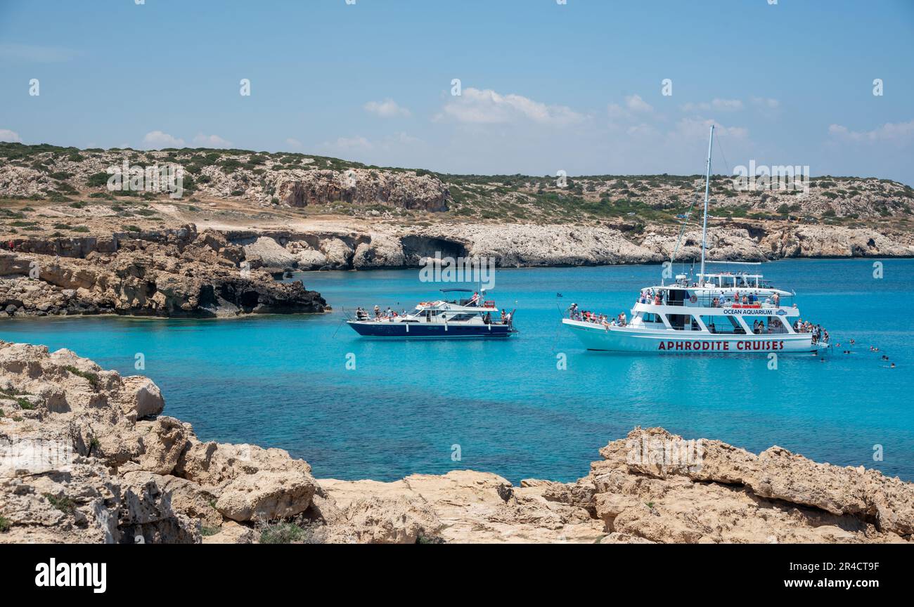 Tourist yachts with people sailing in the sea. Summer holidays in the ...
