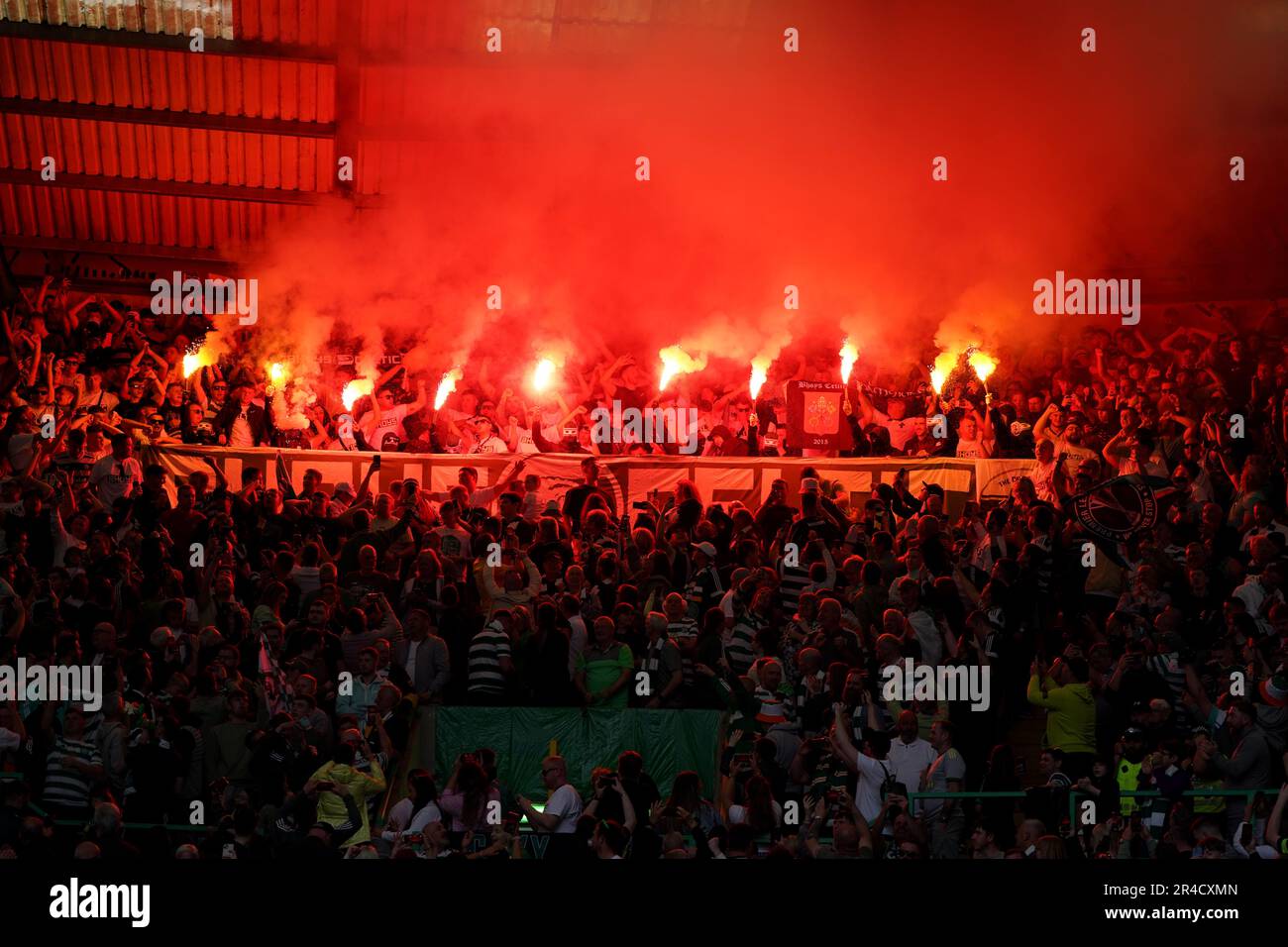 Celtic fans hold smoke flares in the stands during the cinch ...