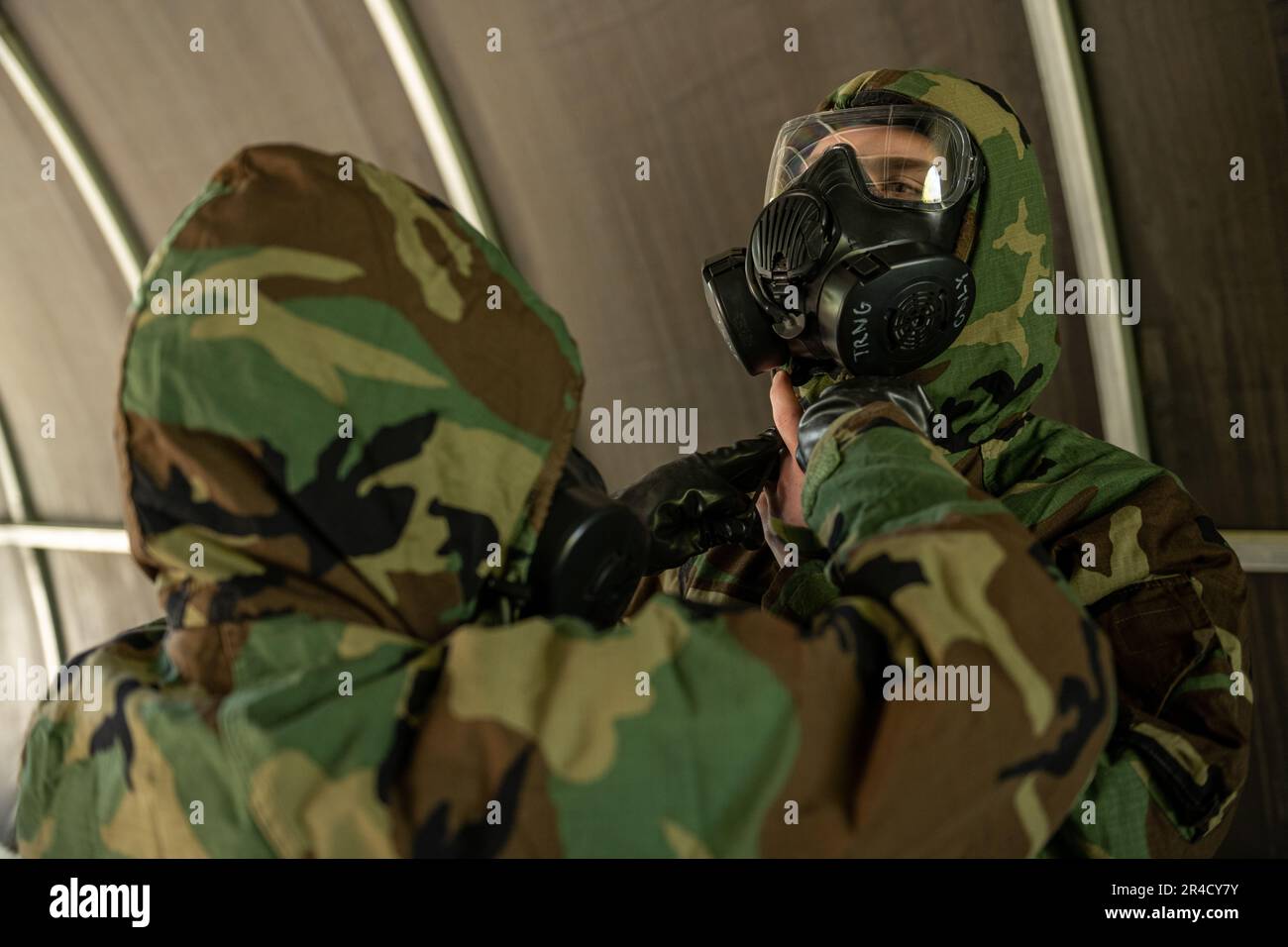 U.S. Airmen assigned to the 23rd Wing perform buddy checks during a ...