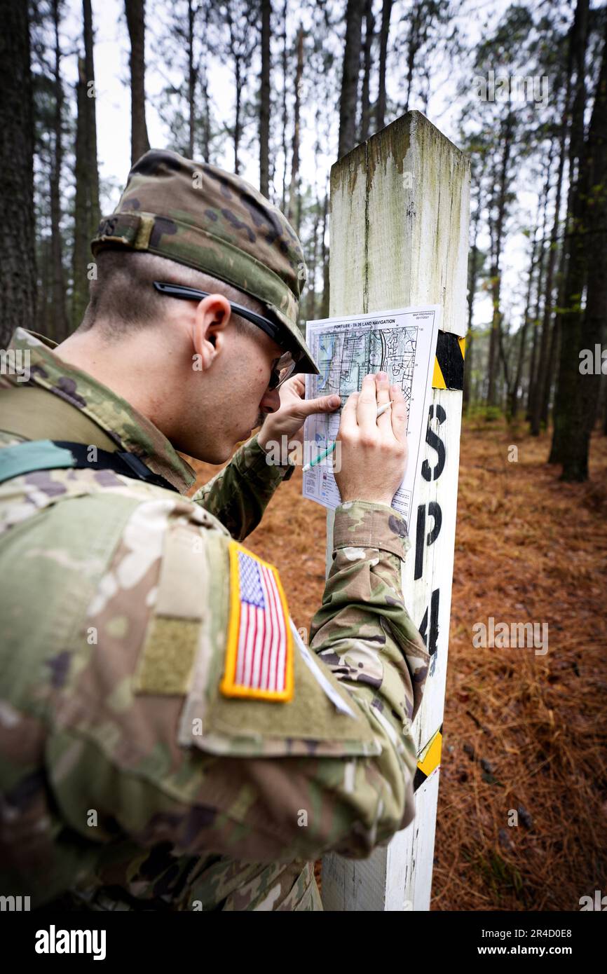 A Soldier plots coordinates in preparation to complete the land ...