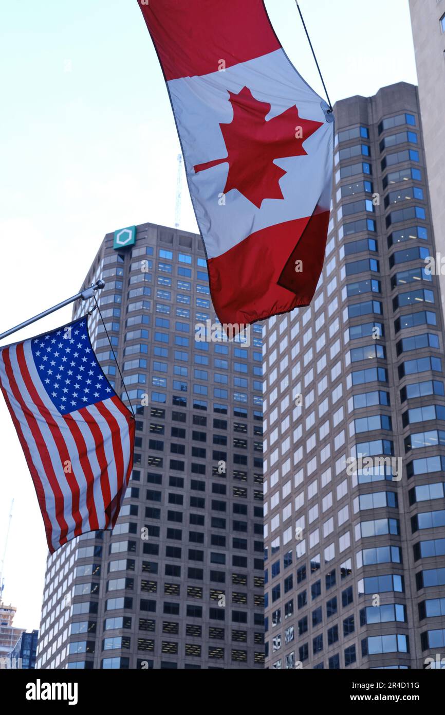 Canadian and American flags in a modern North American cityscape Stock ...