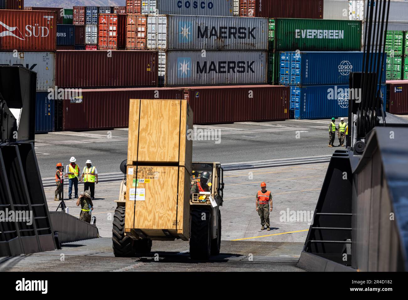 U.S. Marines with 3rd Landing Support Battalion offload materiel from ...