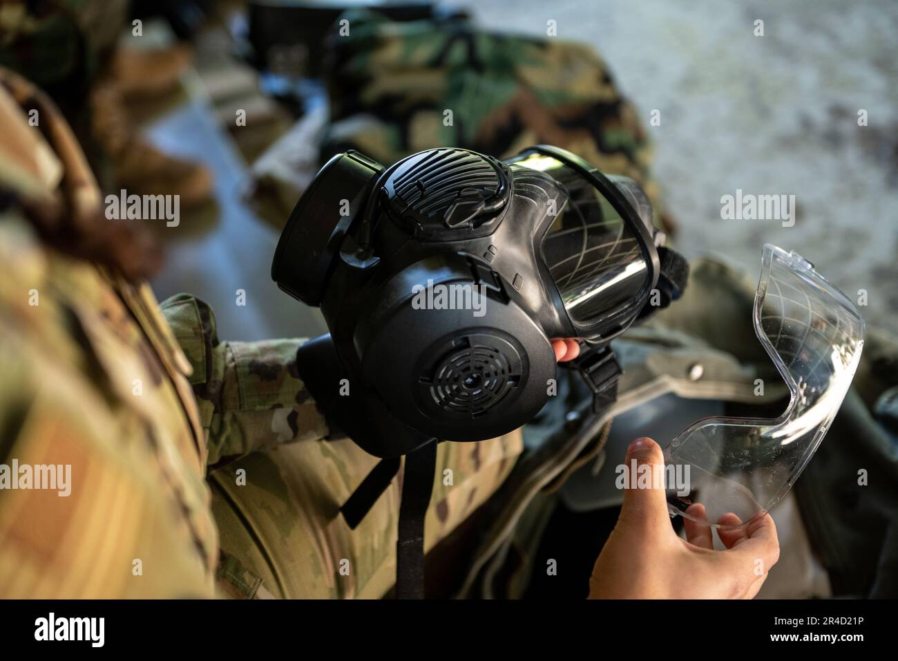 A U.S. Air Force Airman assigned to the 23rd Wing, inspects her gas ...