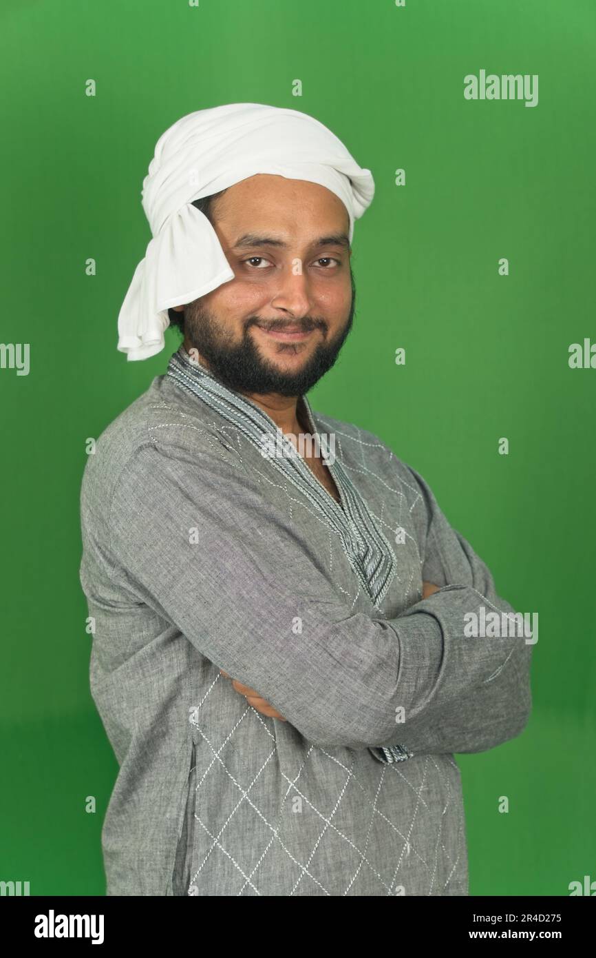 Portrait of young Indian farmer smiling and looking at camera, isolated ...